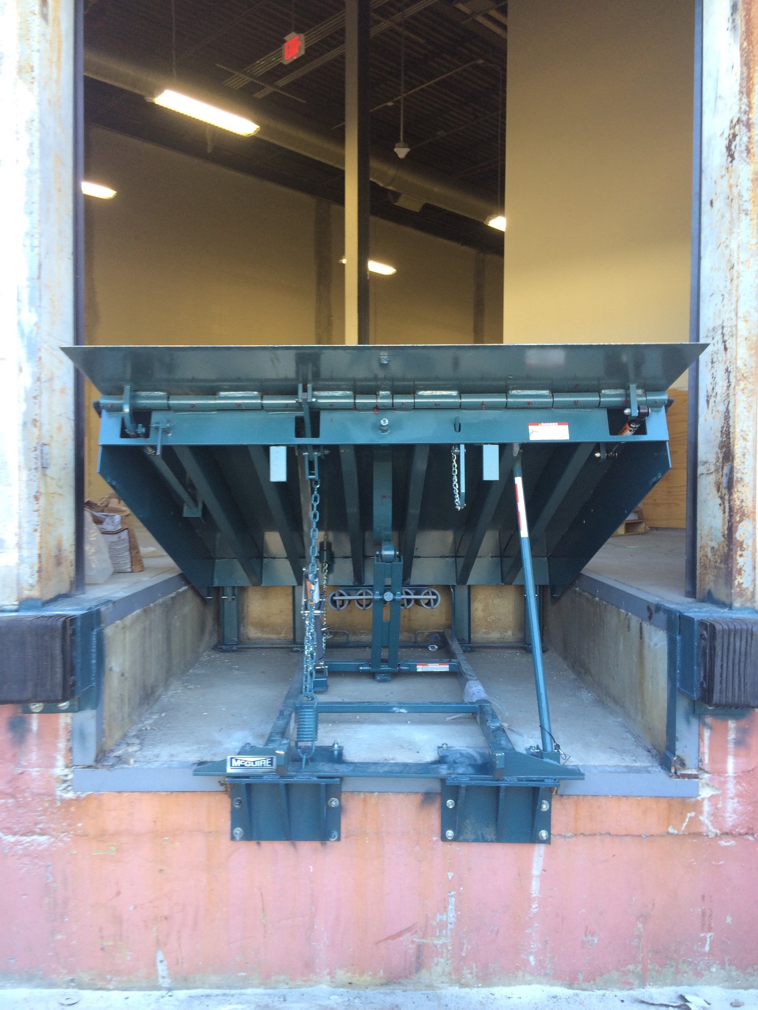 Extended Loading Dock Levelers & Tapered Dock Seals for Declining Driveways Extended Loading Dock Levelers & Tapered Dock Seals for Declining Driveways